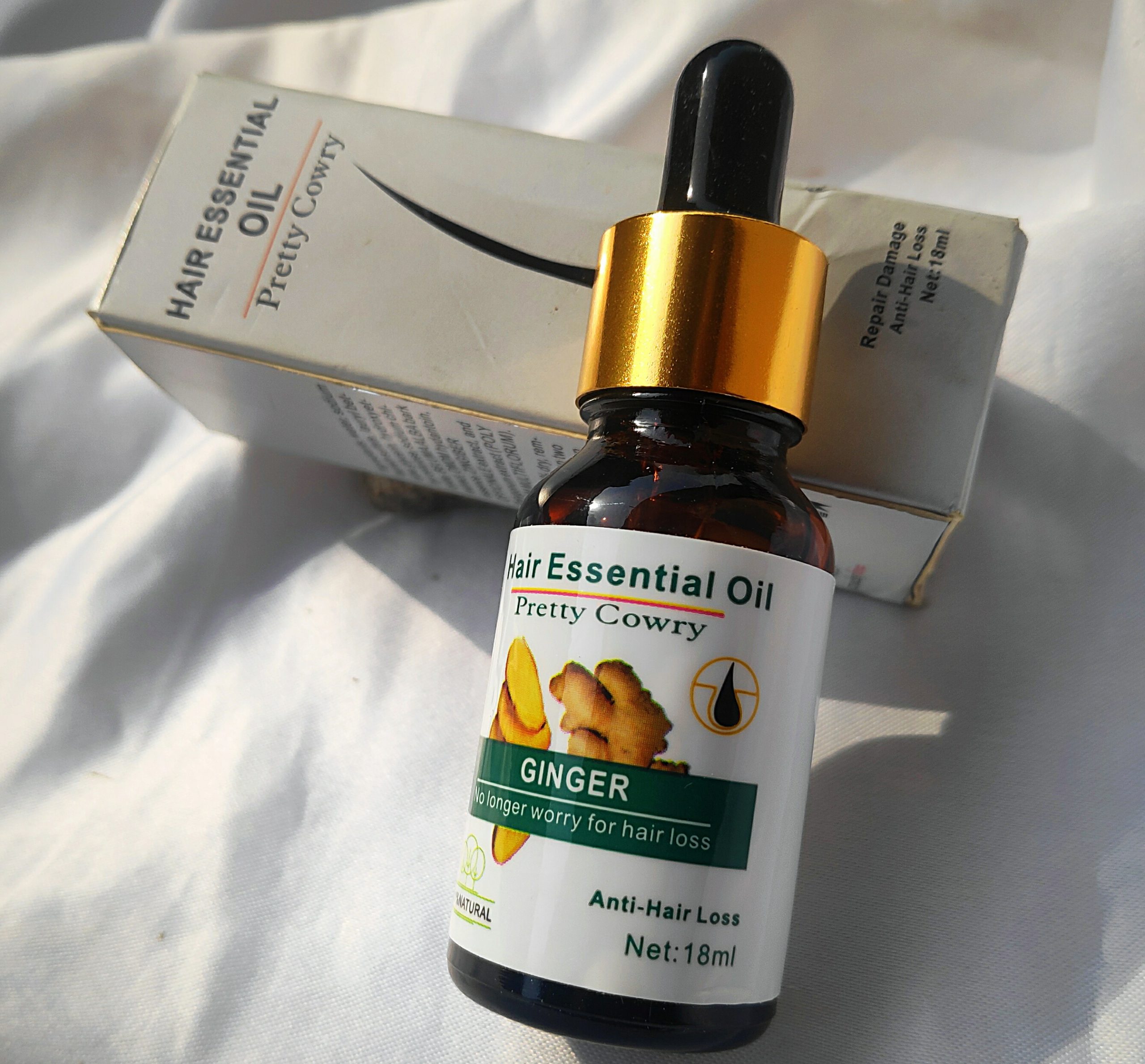Pretty Cowry Hair Essential Oil – Mil Options-Plus Pretty Cowry Hair Essential Oil – Mil Options-Plus